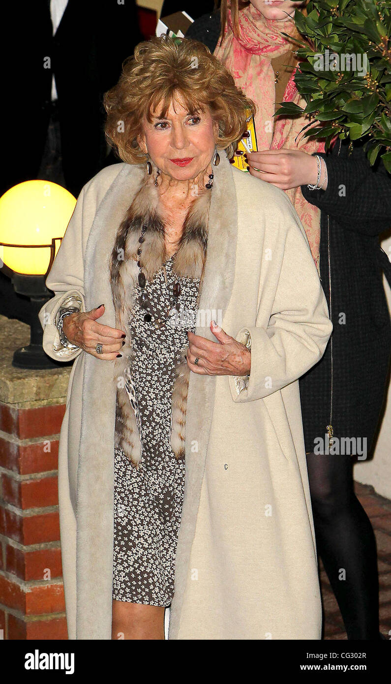 Julie Cowell, Simon Cowell's mother, leaves the studio after 'The X ...