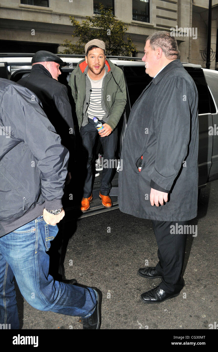 X Factor 2010 winner Matt Cardle arrives at the May Fair hotel flanked ...