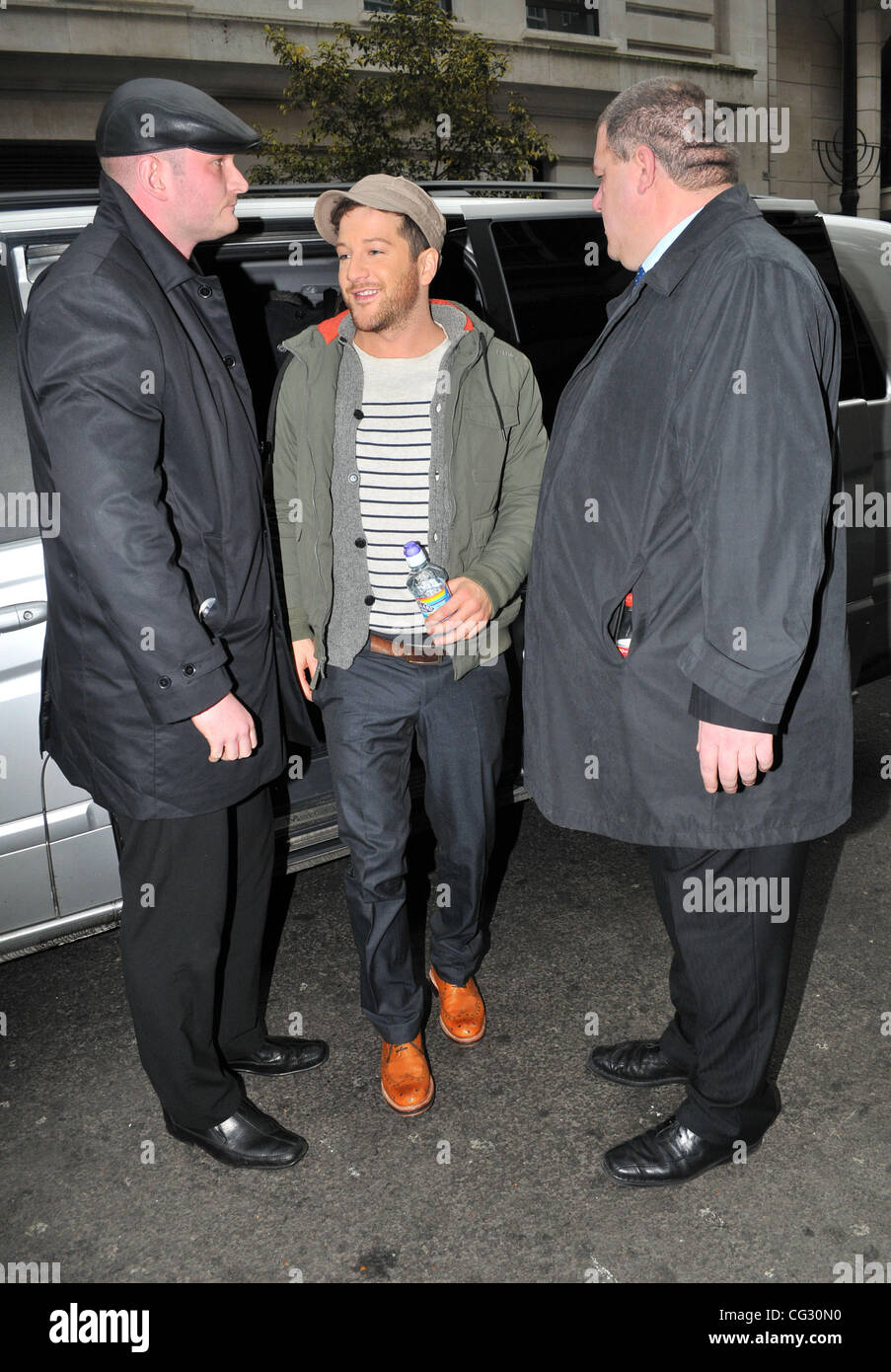 X Factor 2010 winner Matt Cardle arrives at the May Fair hotel flanked ...