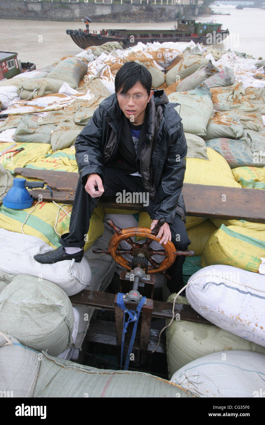 SHIP LOADS OF RICE A ship overloaded with bags of rice was confiscated ...