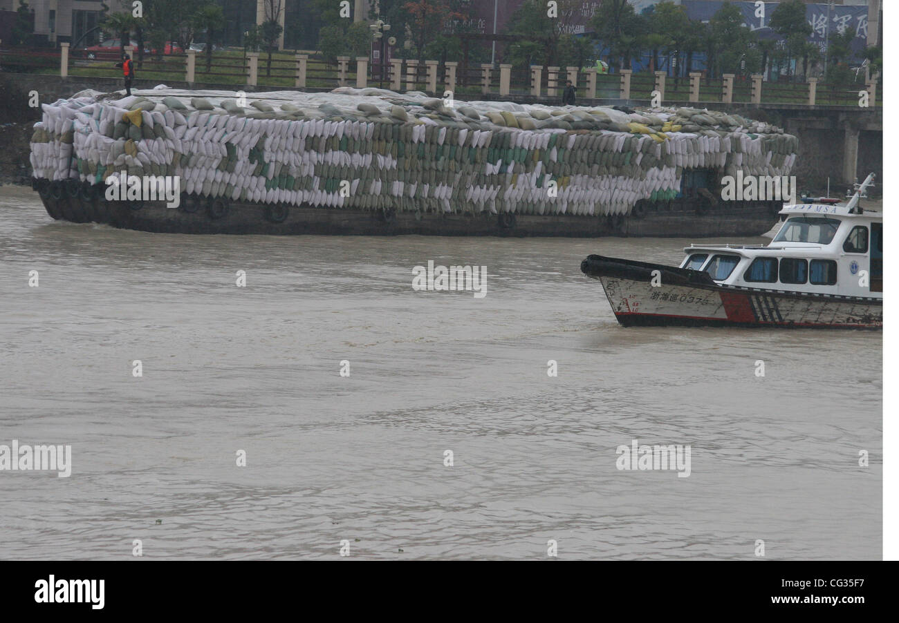SHIP LOADS OF RICE A ship overloaded with bags of rice was confiscated ...