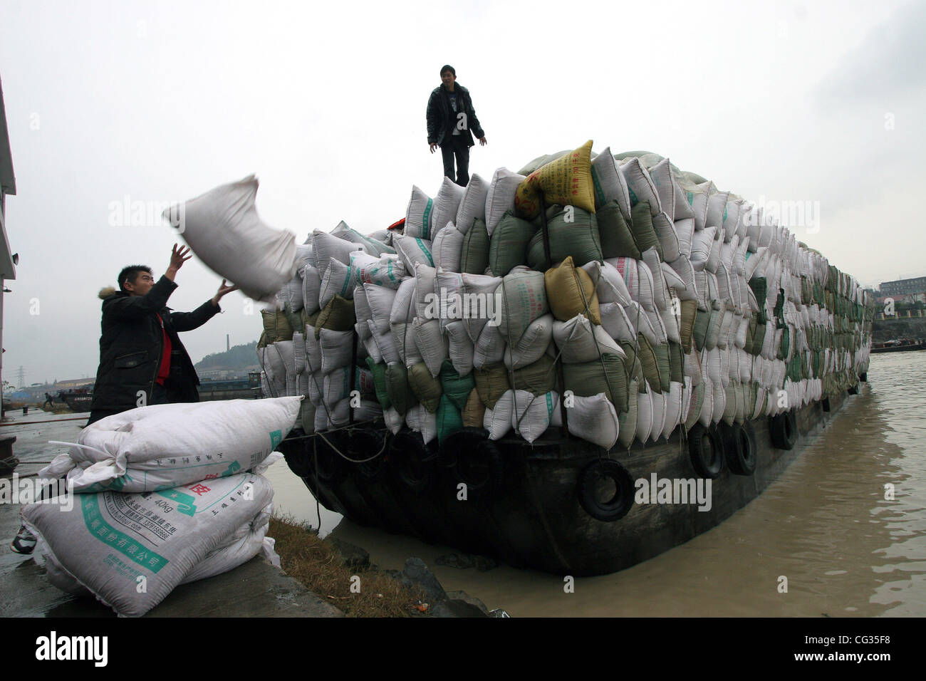 SHIP LOADS OF RICE A ship overloaded with bags of rice was confiscated ...