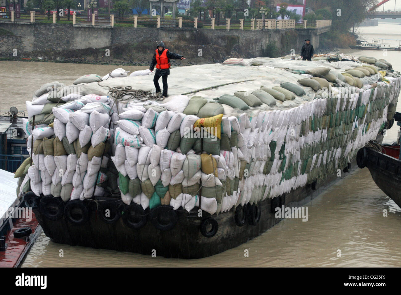 SHIP LOADS OF RICE A ship overloaded with bags of rice was confiscated ...
