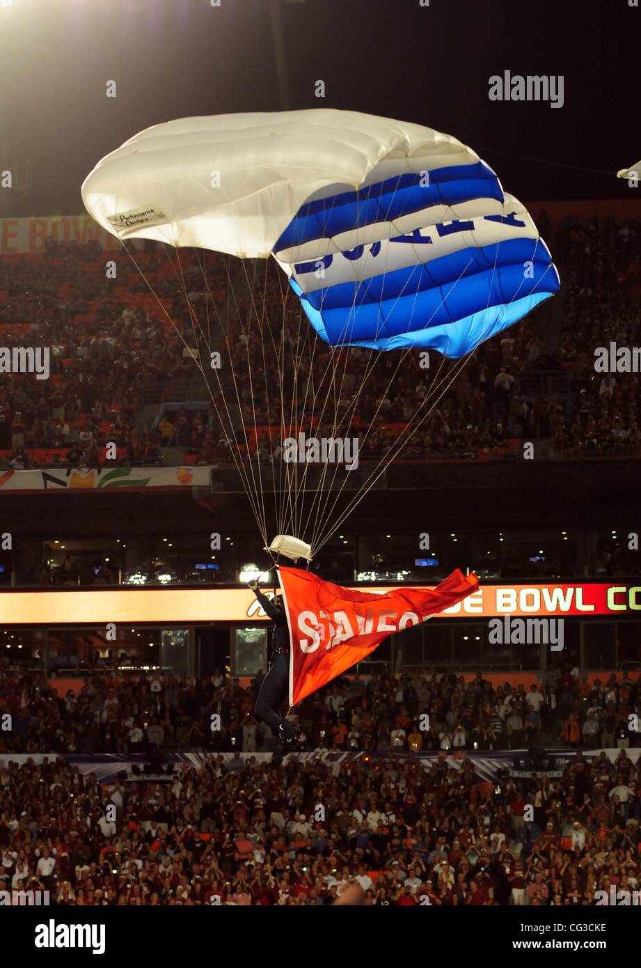 Parachutist at the pre-game shows during 2011 Discover Orange Bowl game ...