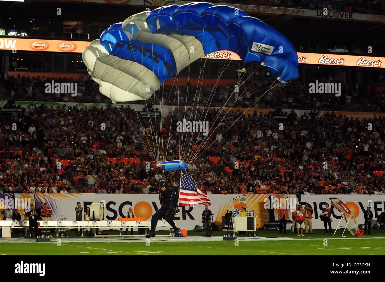 Parachutist at the pre-game shows during 2011 Discover Orange Bowl game ...
