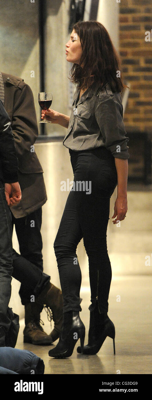 Gemma Arterton shares a rather animated conversation with friends ...