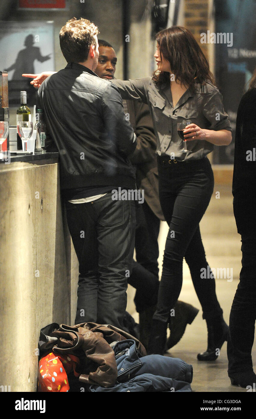 Gemma Arterton shares a rather animated conversation with friends ...