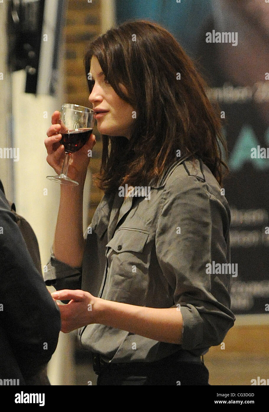 Gemma Arterton shares a rather animated conversation with friends ...