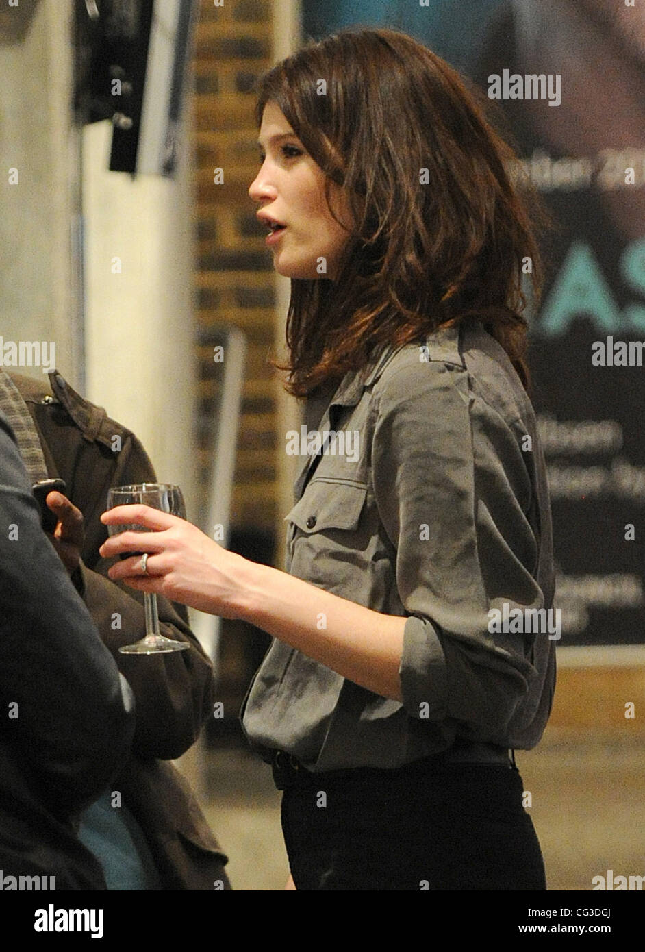 Gemma Arterton shares a rather animated conversation with friends ...