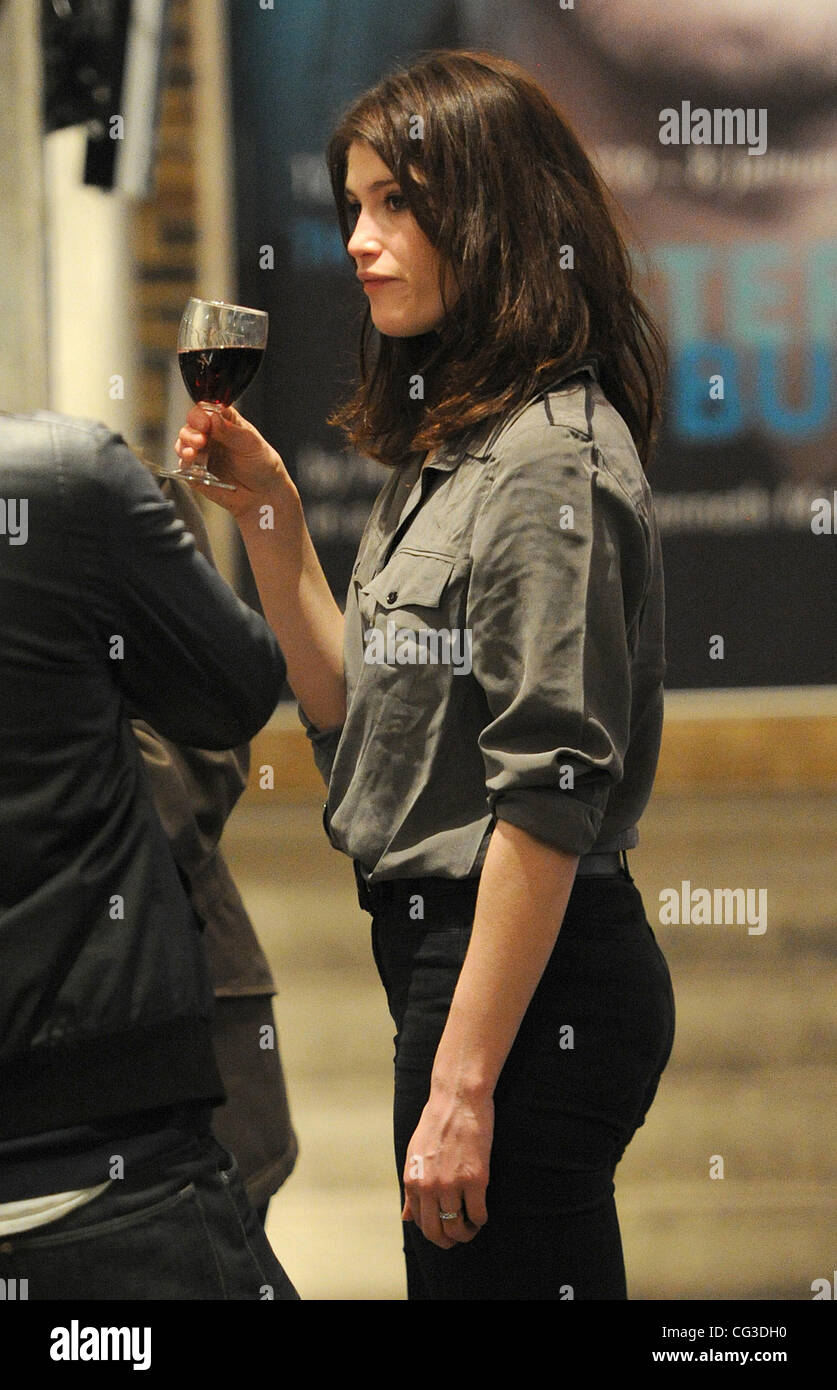 Gemma Arterton shares a rather animated conversation with friends ...