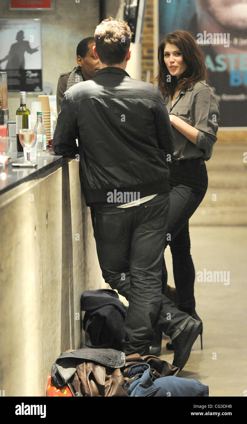 Gemma Arterton shares a rather animated conversation with friends ...