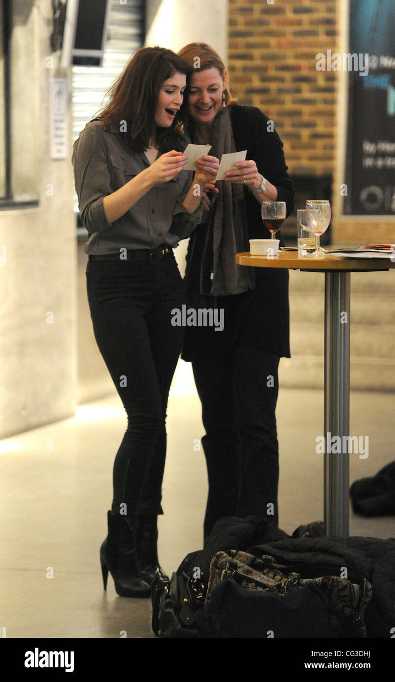 Gemma Arterton shares a rather animated conversation with friends ...
