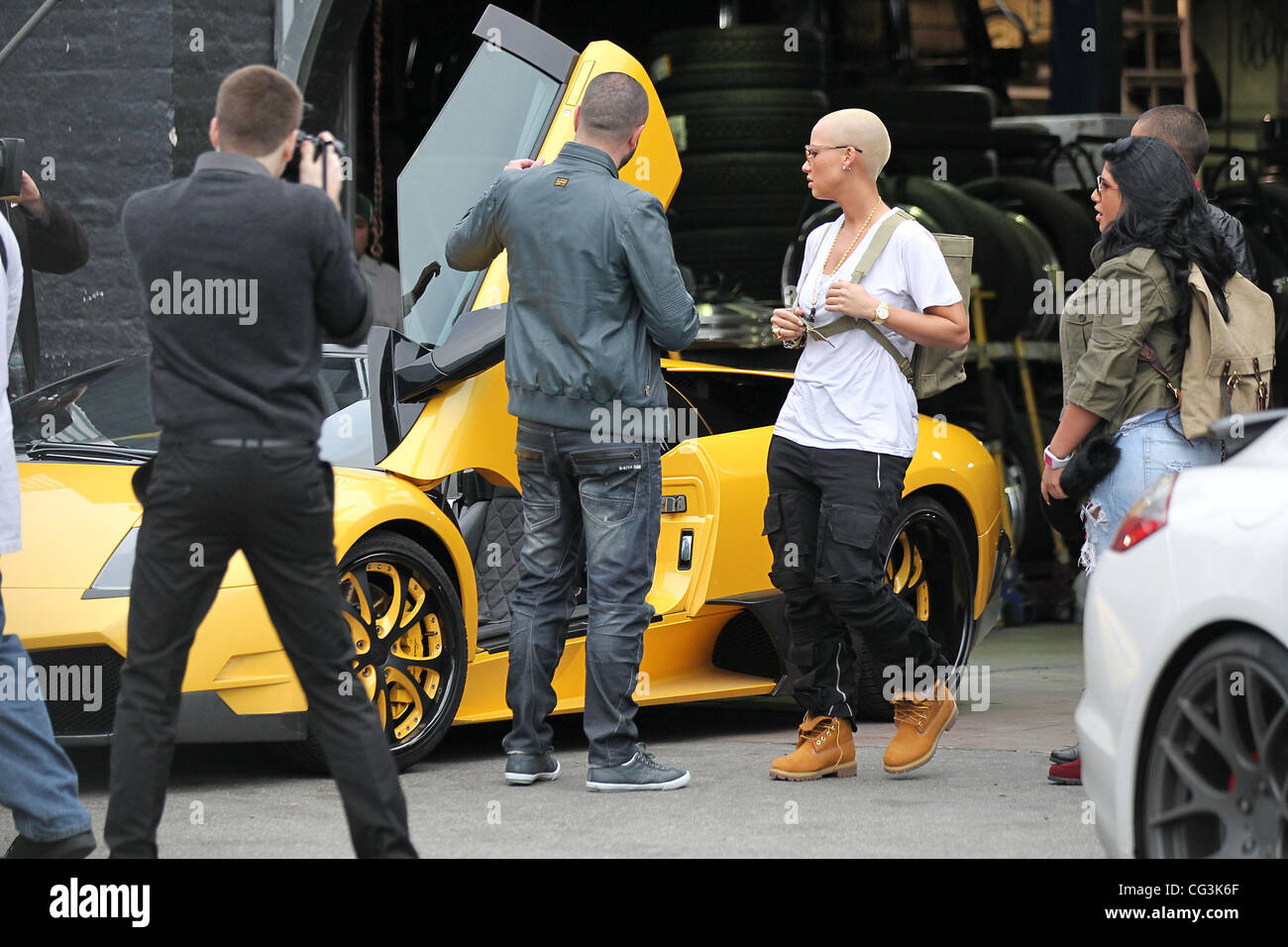 Amber Rose looking at a lamborghini sports car at Platinum Motorsports ...