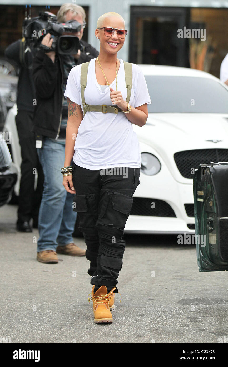 Amber Rose looking at customised cars at Platinum Motorsports in ...
