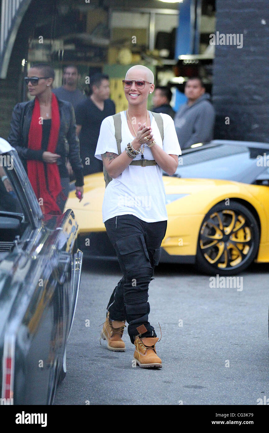 Amber Rose looking at a lamborghini sports car at Platinum Motorsports ...