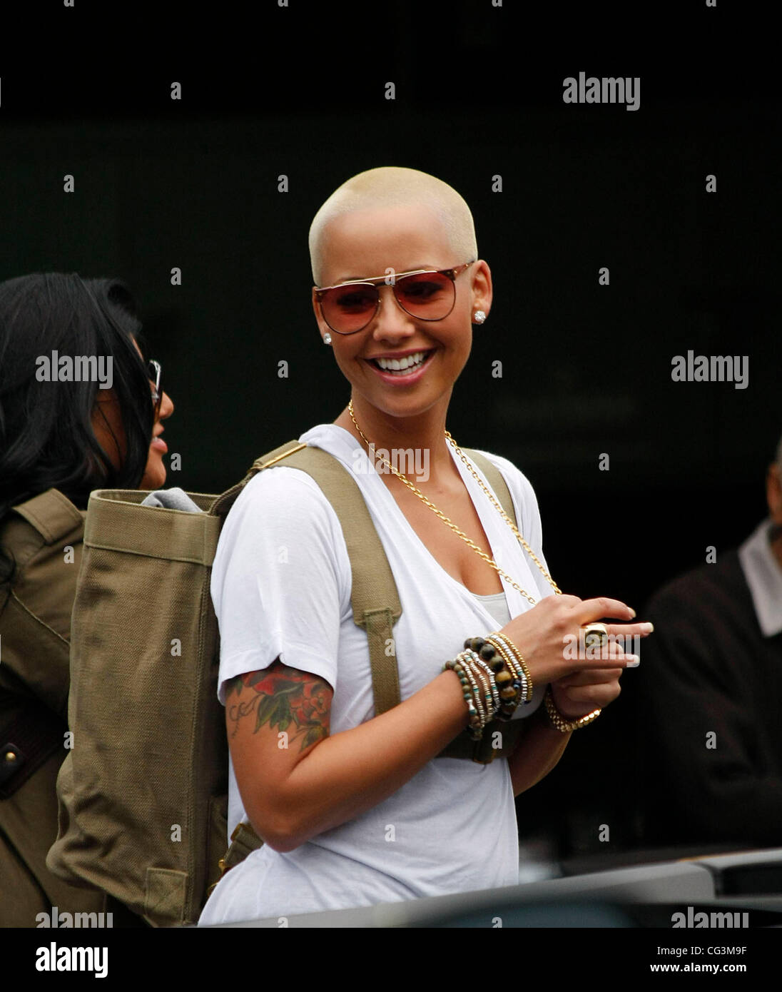 Amber Rose looking at customised cars at Platinum Motorsports in ...