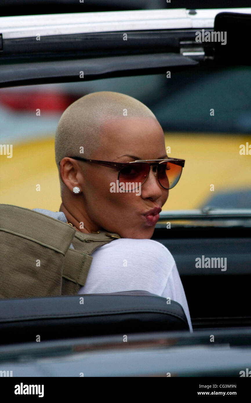 Amber Rose looking at customised cars at Platinum Motorsports in ...
