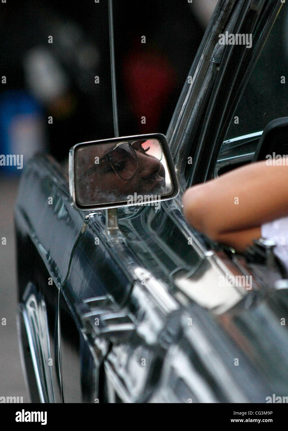 Amber Rose looking at customised cars at Platinum Motorsports in ...