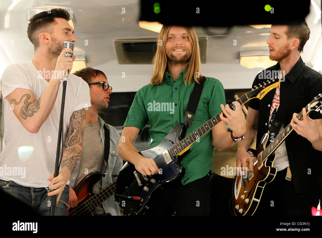 Adam Levine, James Levine (centre) and Jesse Carmichael shooting scenes ...