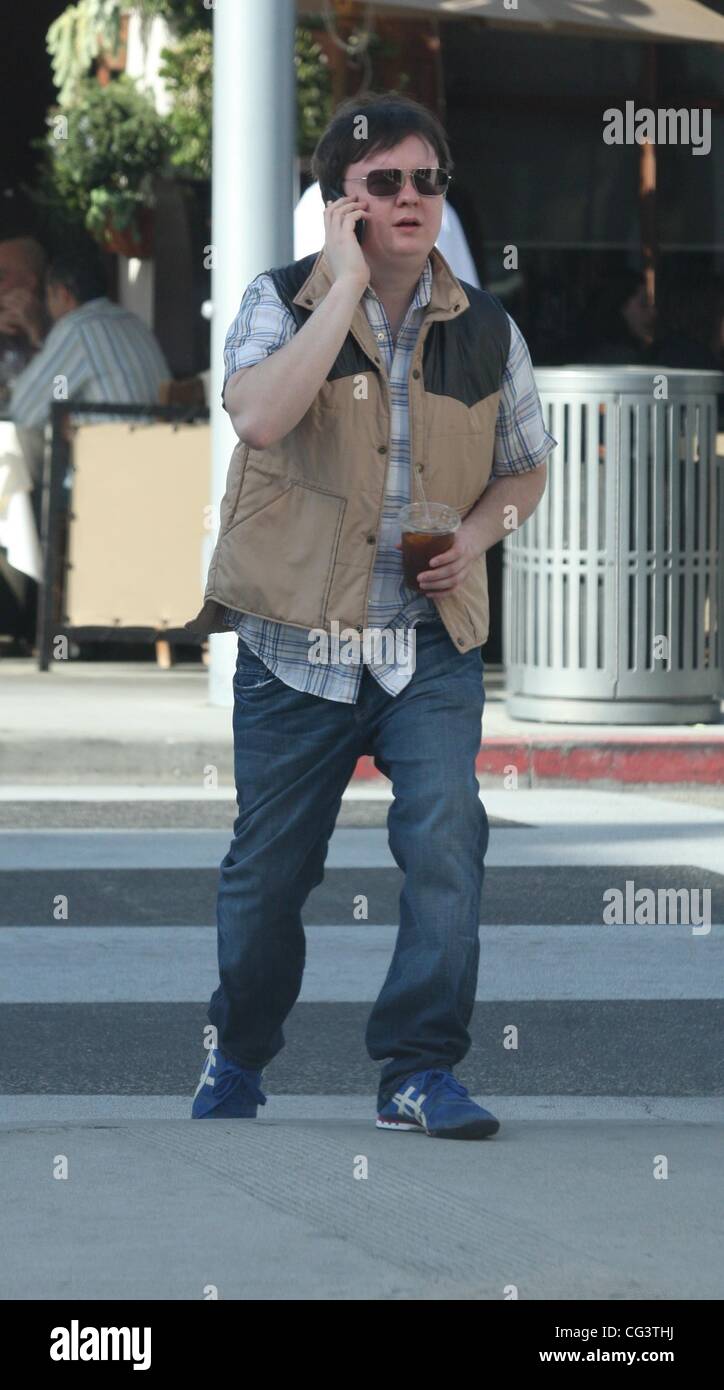 Clark Duke drinking an iced drink while out and about in Beverly Hills ...