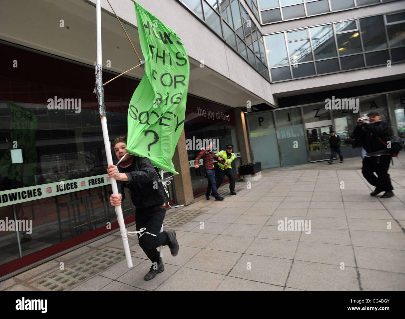 A student runs riot with a banner Students protest against the public ...
