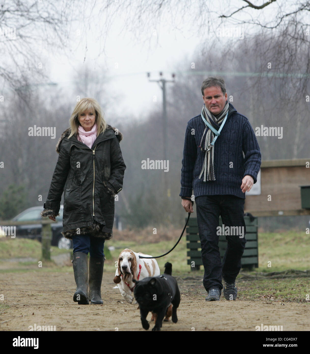 Richard Keys and his wife Julia taking their dogs for a walk London ...