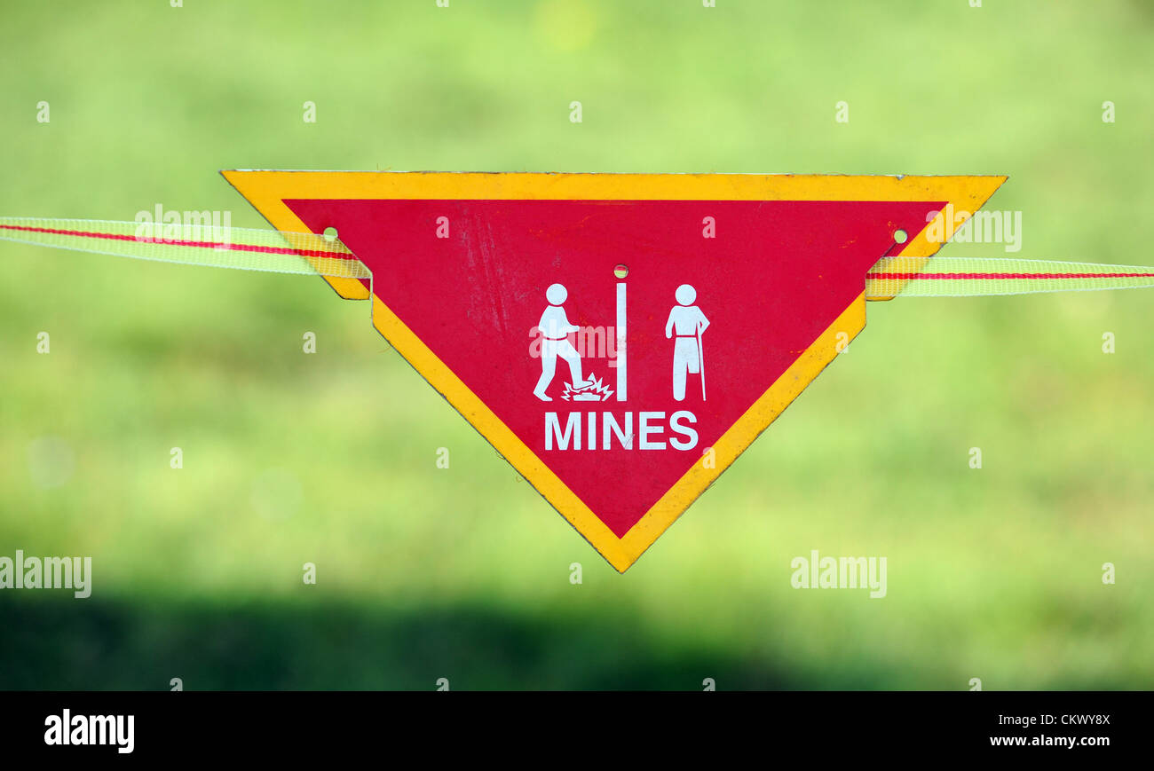 Mine field warning sign and tape Stock Photo - Alamy