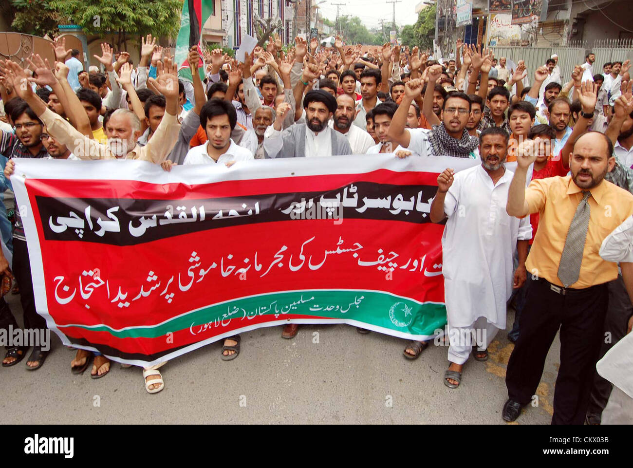 Supporters of Majlis Wahdat-e-Muslimeen (MWM) chant slogans in favor of ...