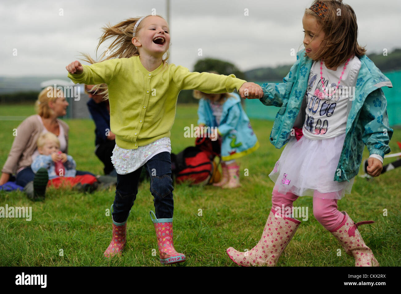 Saturday August 25th 2012. Aberystwyth, Wales, UK. Two girls dance at ...
