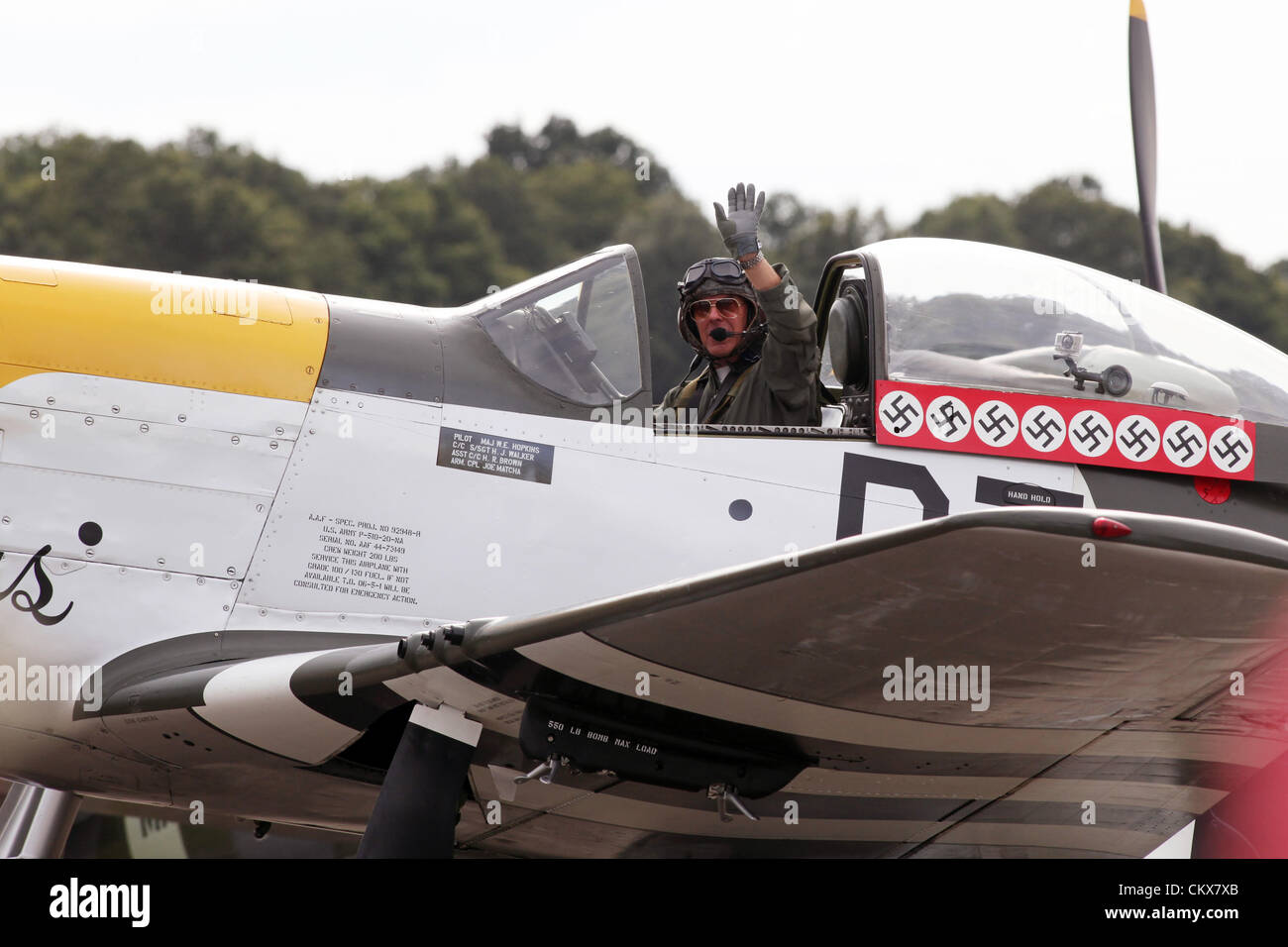 26th Aug 2012. The Mustang pilot waves to the crowd at Wings and Wheels ...