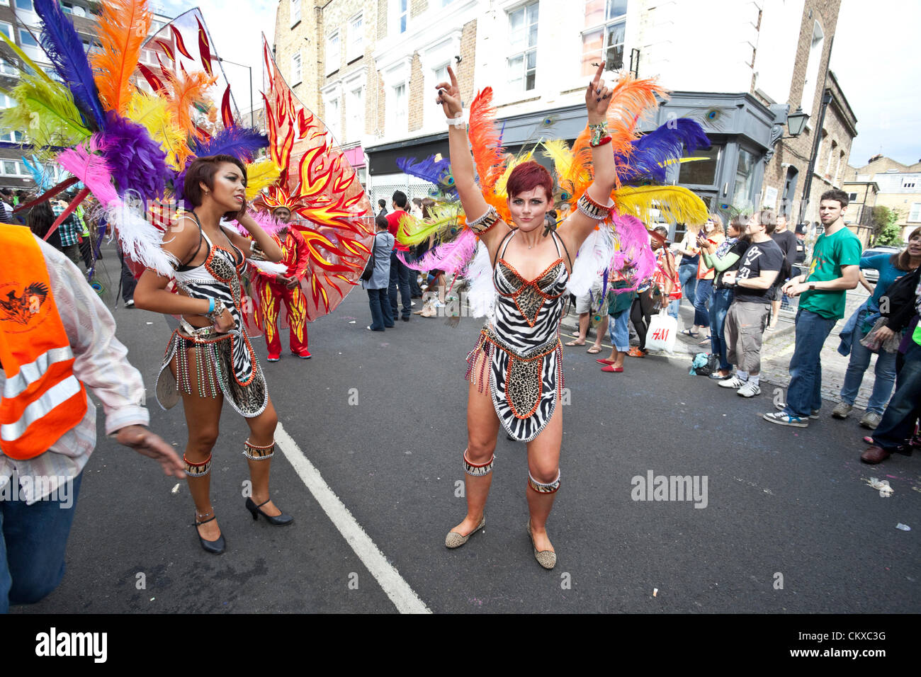 Notting Hill Carnival dancers perform in colourful costumes, London ...