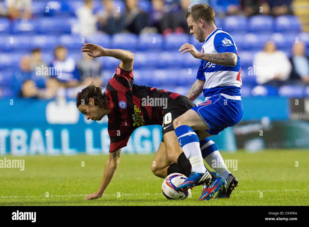 Reading, UK. 28th Aug 2012. Nat Knight-Percival and Ian Harte in action ...