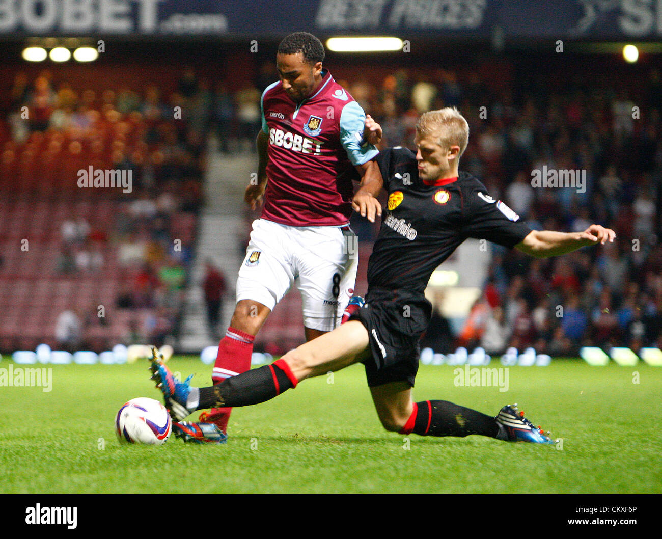 28.08.12 London, ENGLAND: Harry Davis of Crewe Alexandra tackles Nicky ...