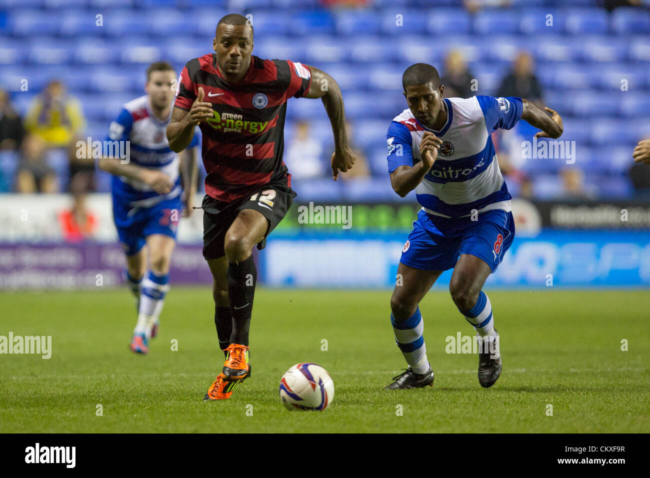 Reading, UK. 28th Aug 2012. Emile Sinclair and Mikele Leigertwood in ...