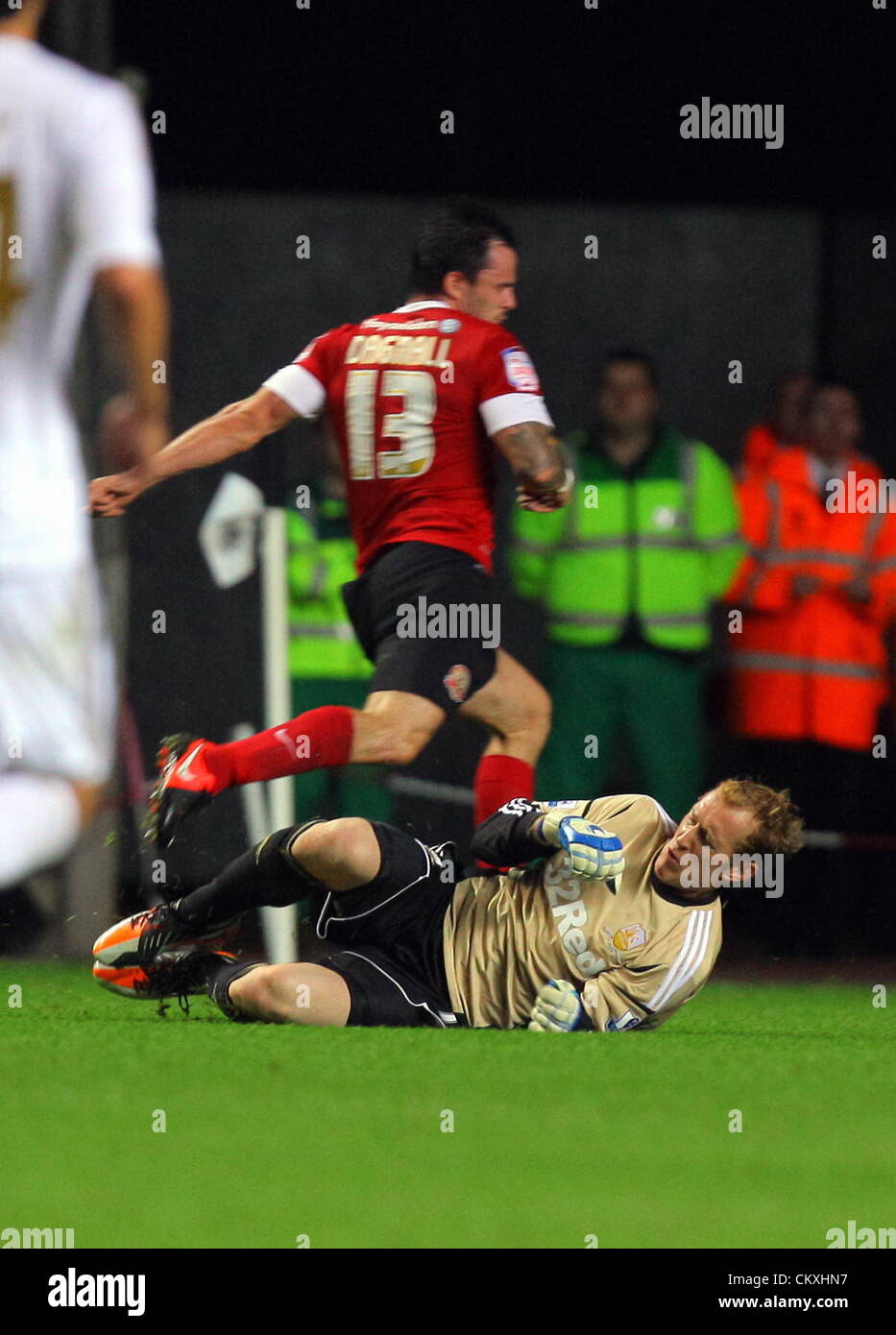 Pictured: Goalkeeper Gerhard Tremmel of Swansea (on the ground) stops ...