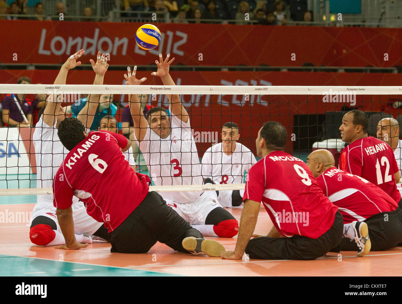 Men's sitting volleyball game between Morocco (white) and Egypt (red ...