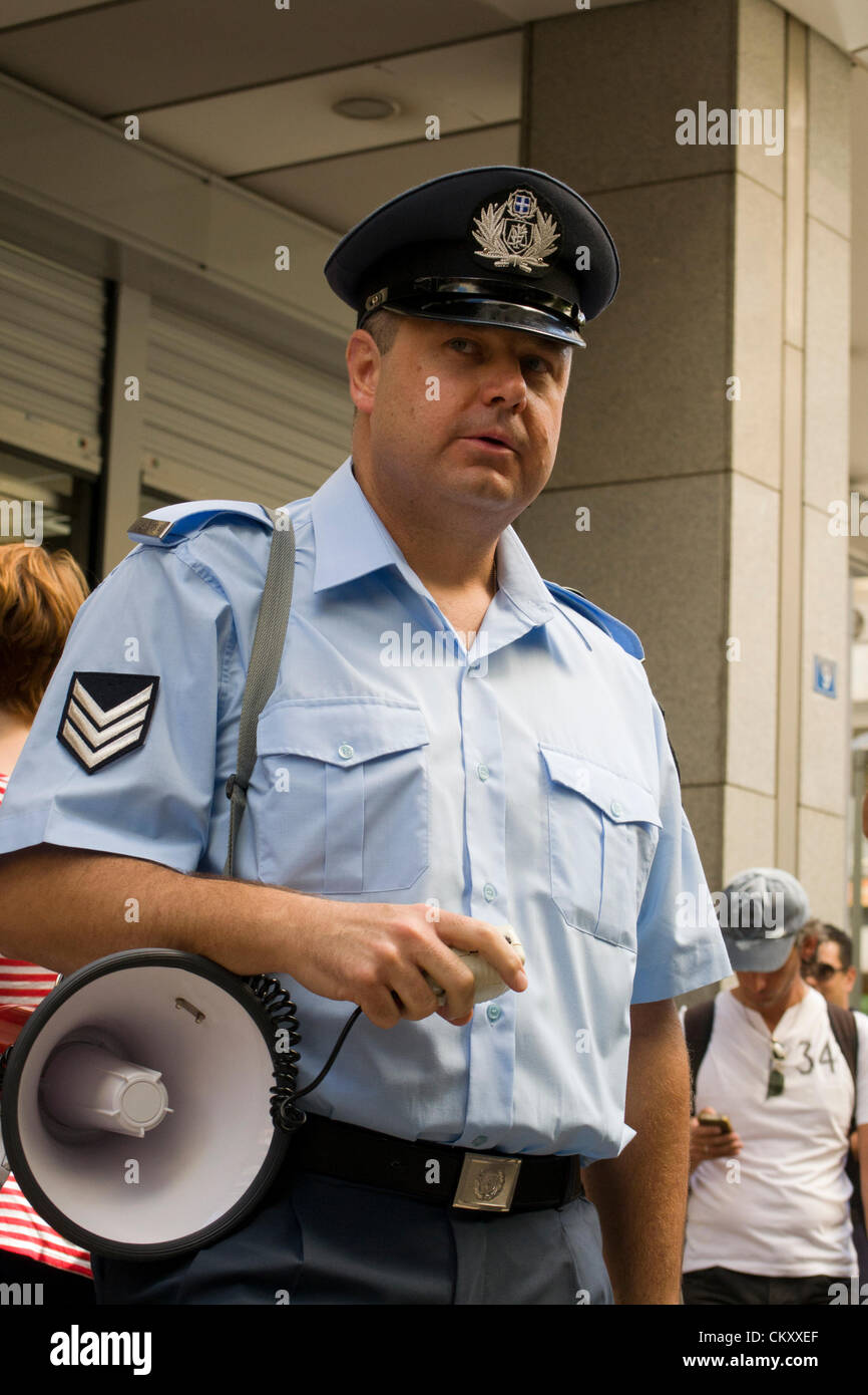 A protesting policeman with a megaphone Stock Photo - Alamy