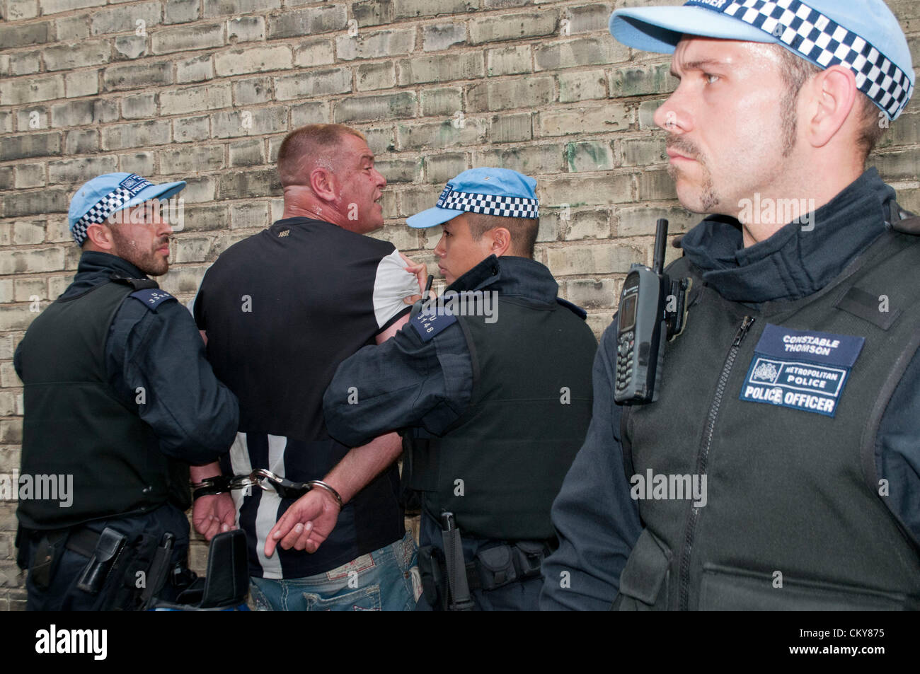 London, UK. 01/09/12. A drunk member of the EDL is arrested by the ...