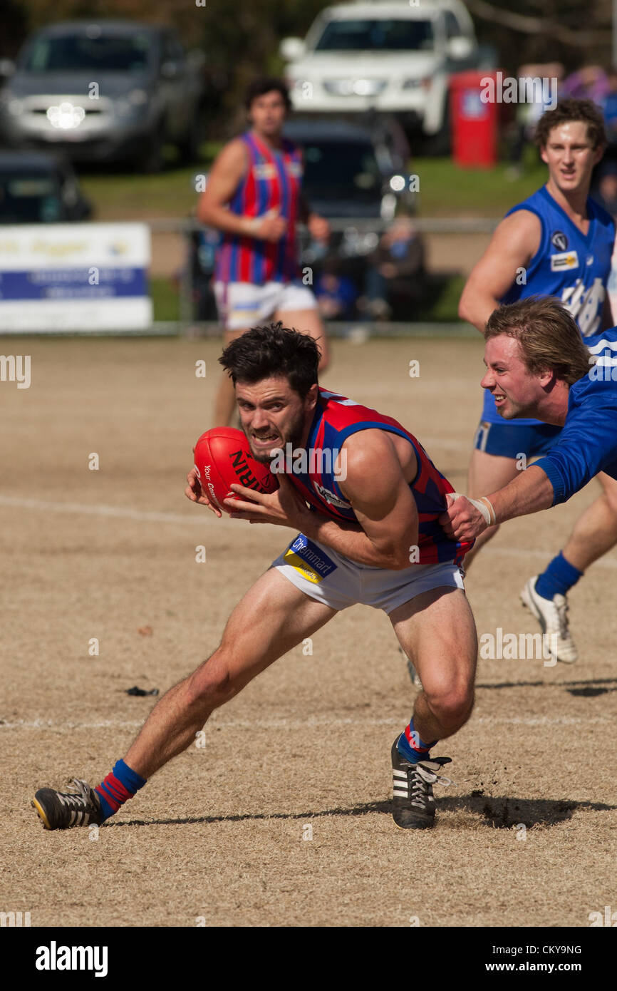 Rye's Bill Kerr evading Colin McVeigh from Hastings. Rye v Hastings ...