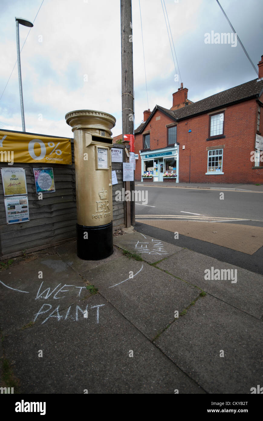 The first post box to be painted gold in Nottinghamshire. It stands ...