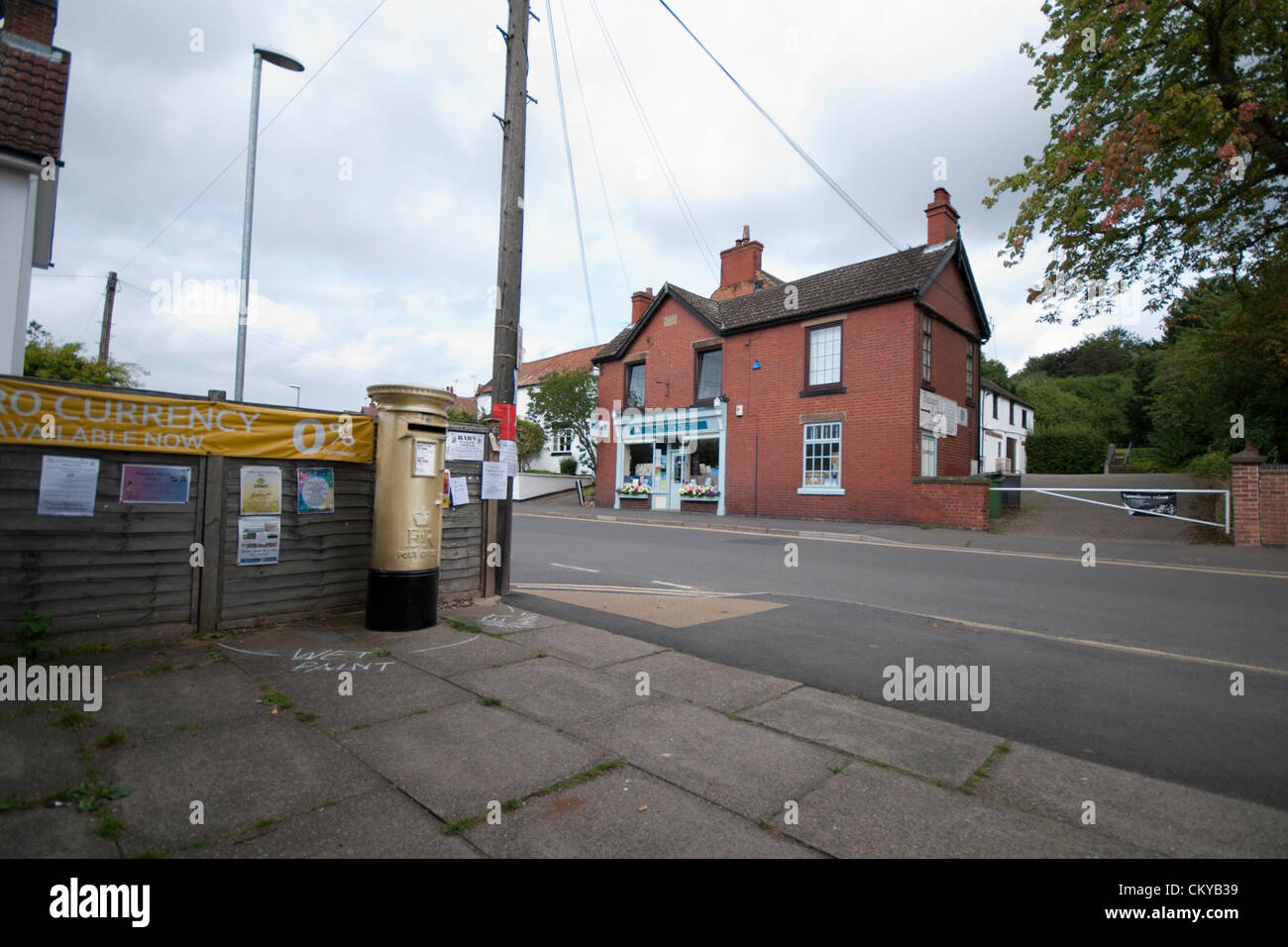 The first post box to be painted gold in Nottinghamshire. It stands ...