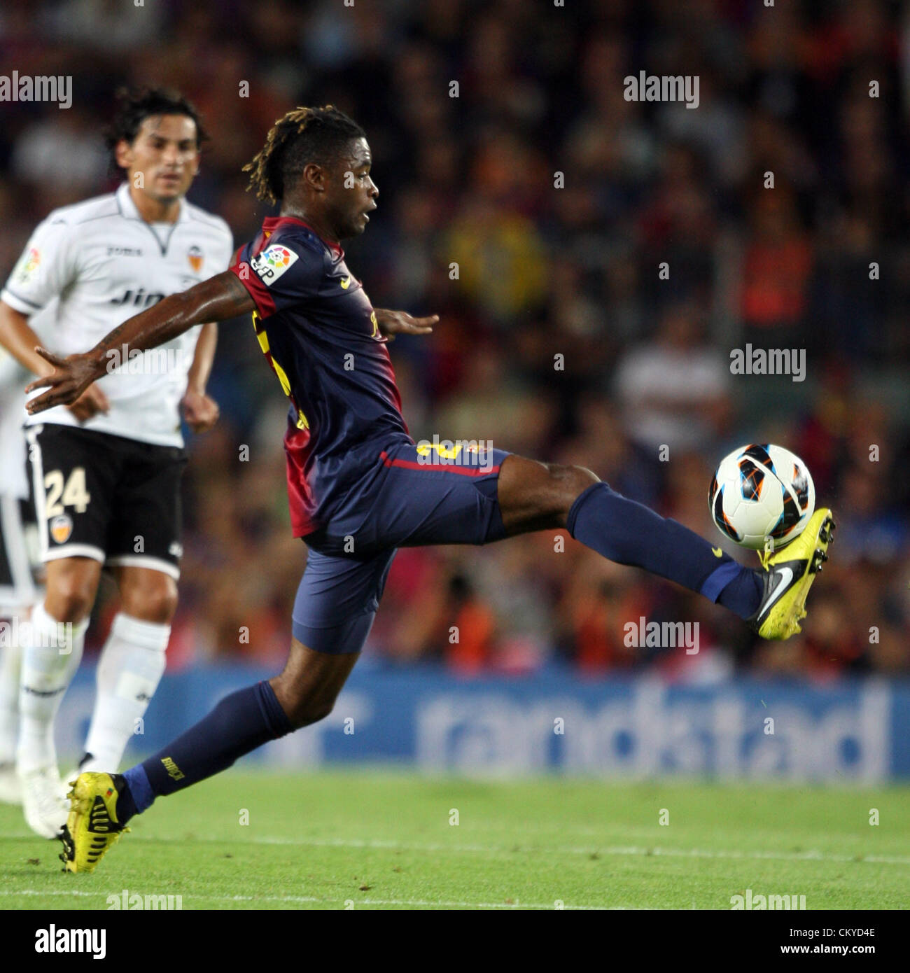 02.09.2012. Barcelona, Spain. Barcelona's Alex Song brings down a ...