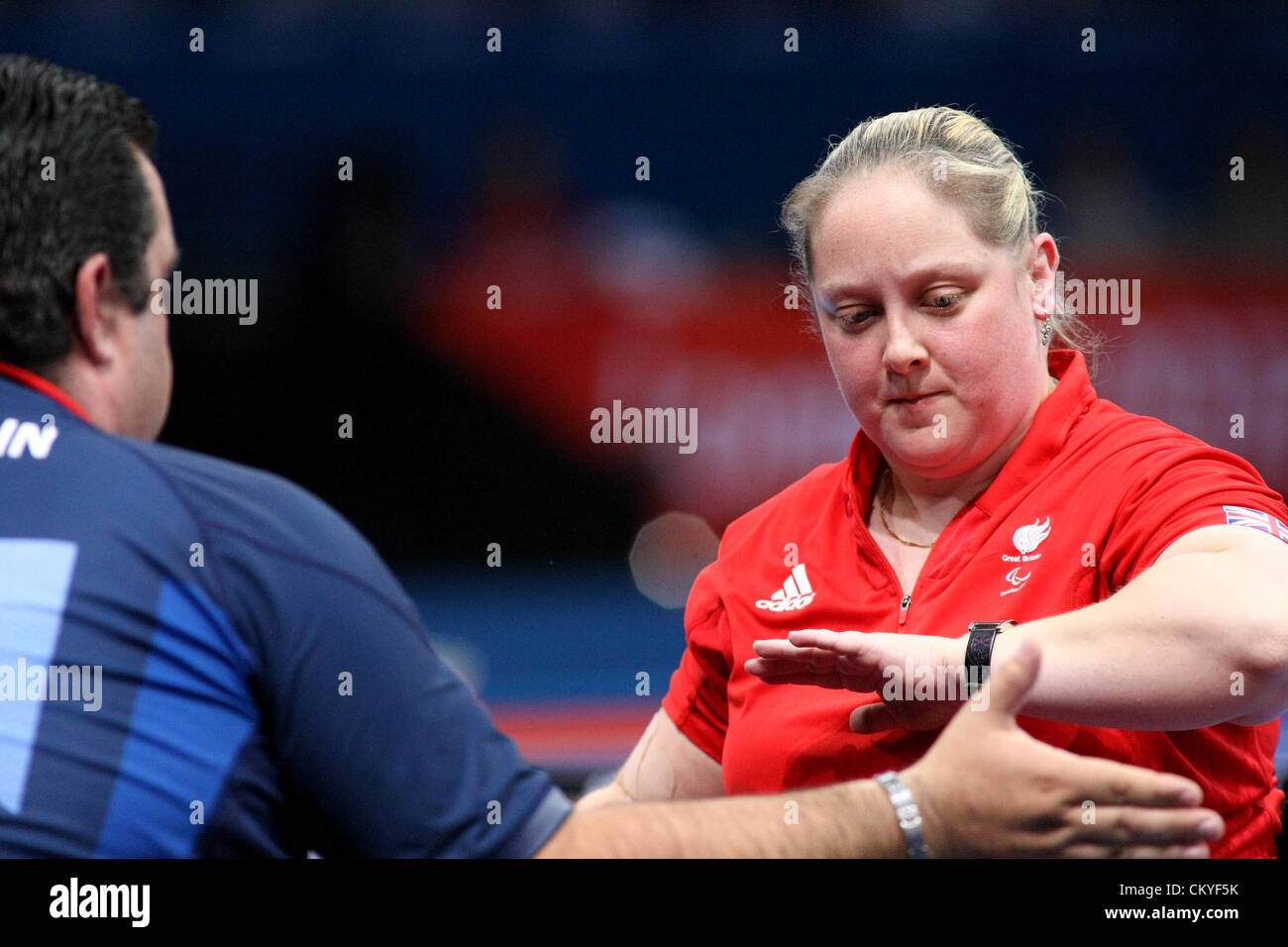 3.09.2012 London, England. Sara Head (GBR) claps hands with her coach ...