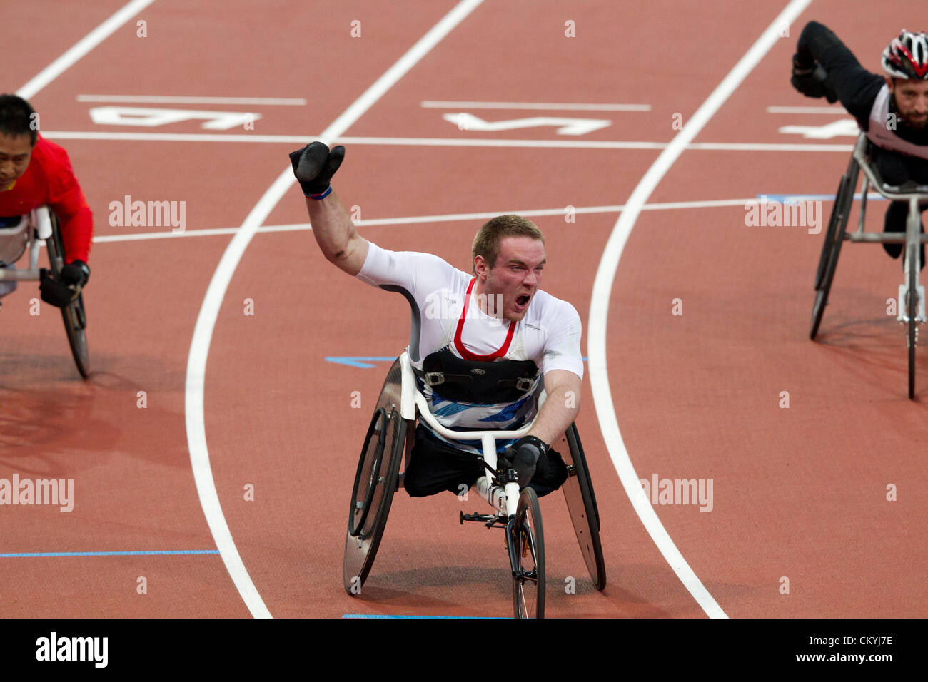 Mickey Bushell of Great Britain gives a fist pump at the finish of the ...