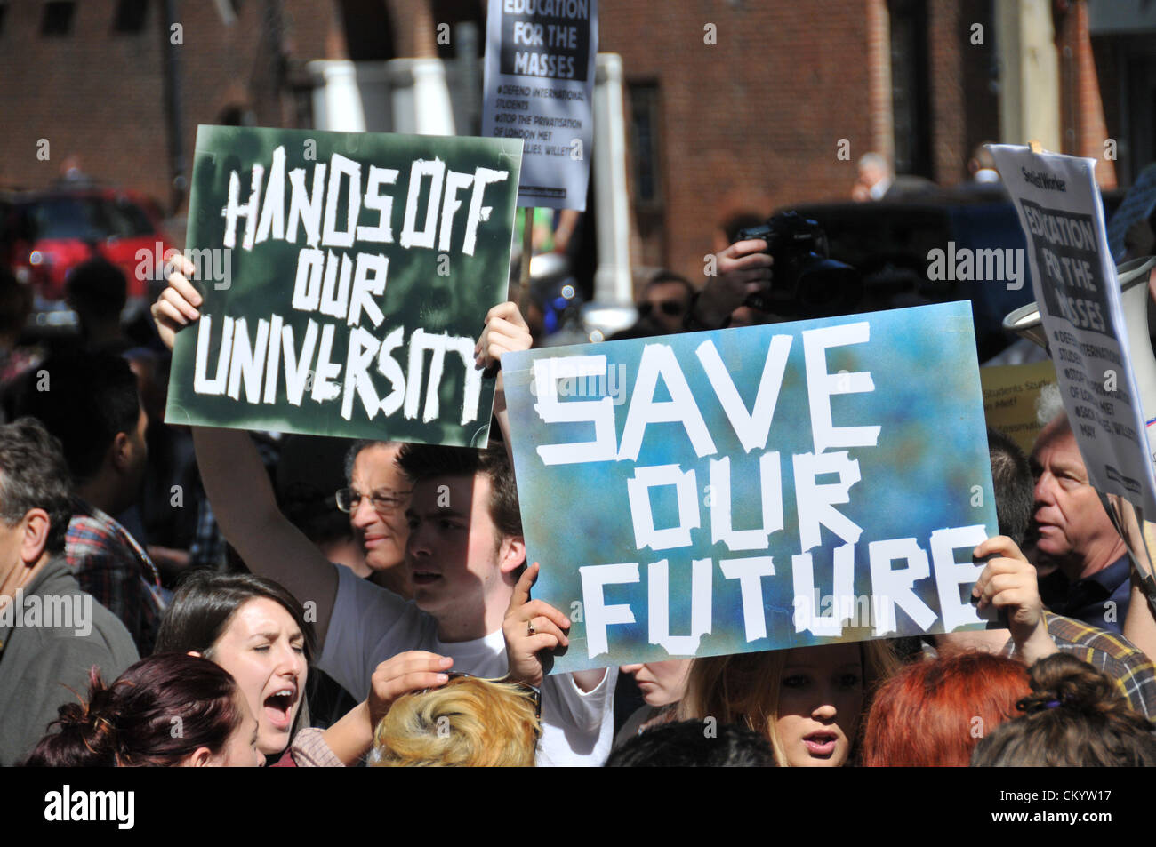Westminster, London, UK. 5th September 2012. Protesters holding banners ...
