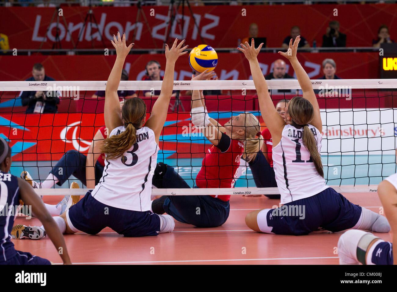 The USA women's sitting volleyball team plays a 1st-round game against ...
