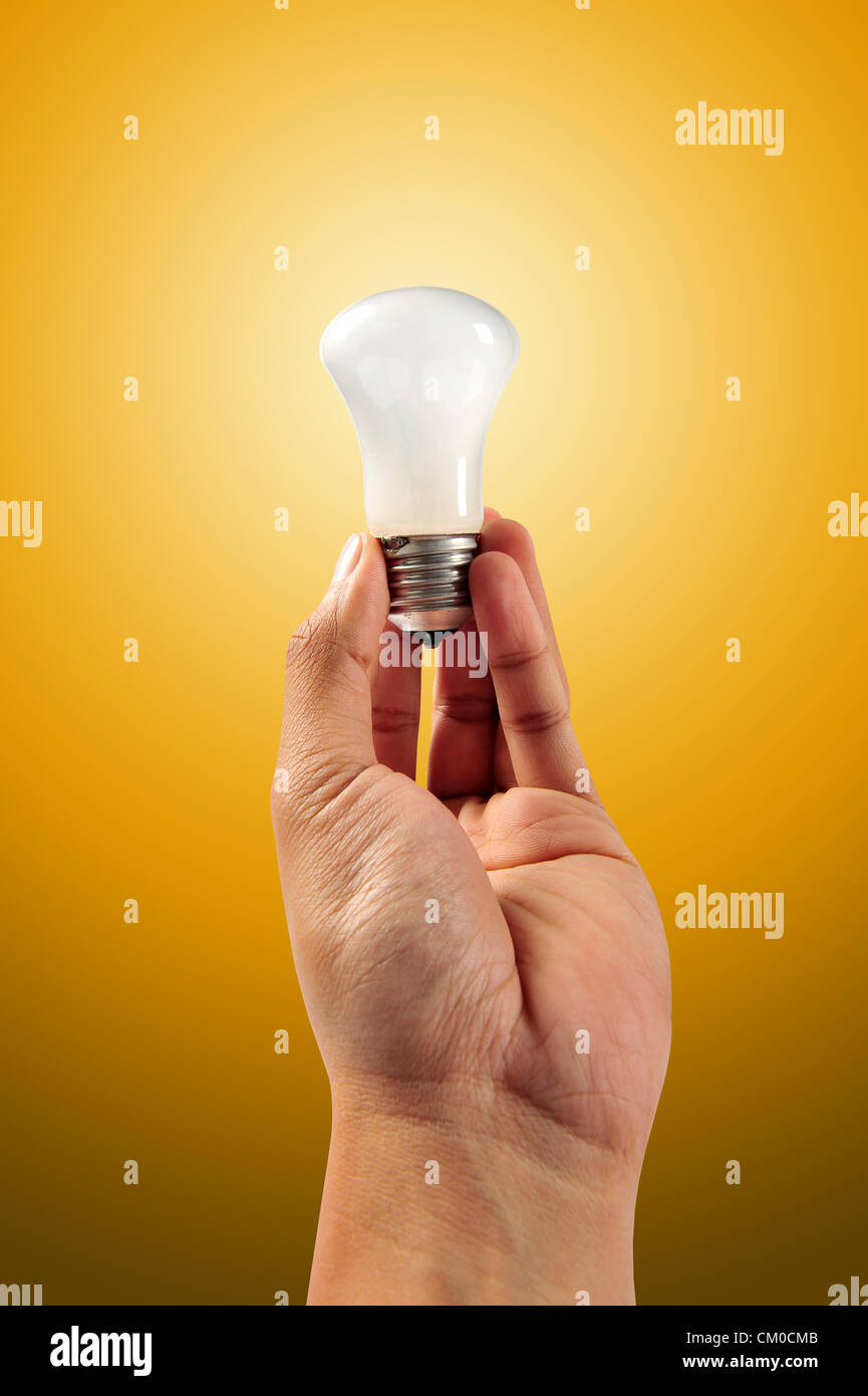 Hand holding filament lamp hi-res stock photography and images - Alamy