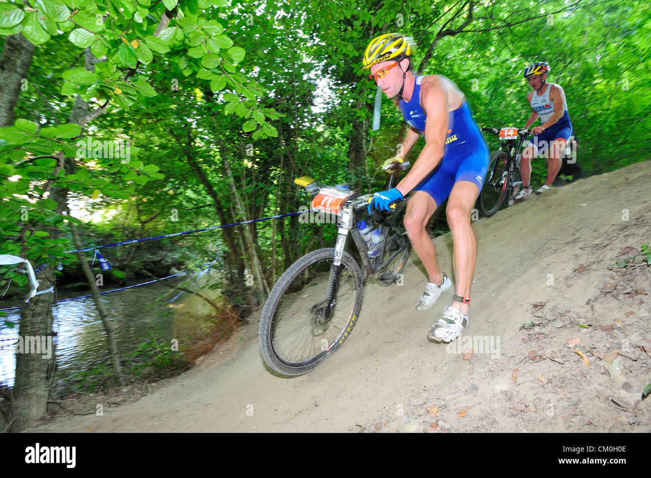 Competitors taking part in the off-road biking stage of the Swiss ...