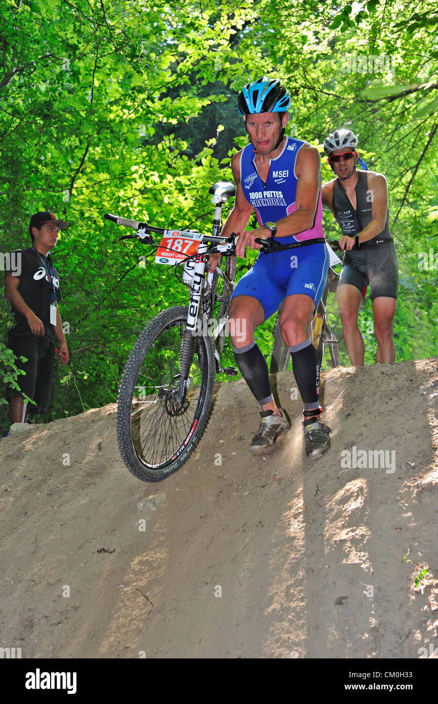 Competitors taking part in the off-road biking stage of the Swiss ...