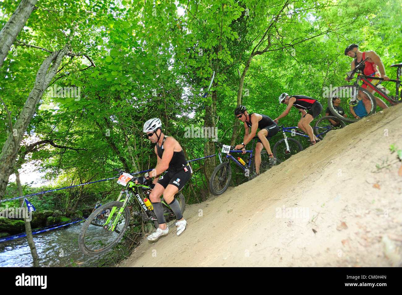 Competitors taking part in the off-road biking stage of the Swiss ...